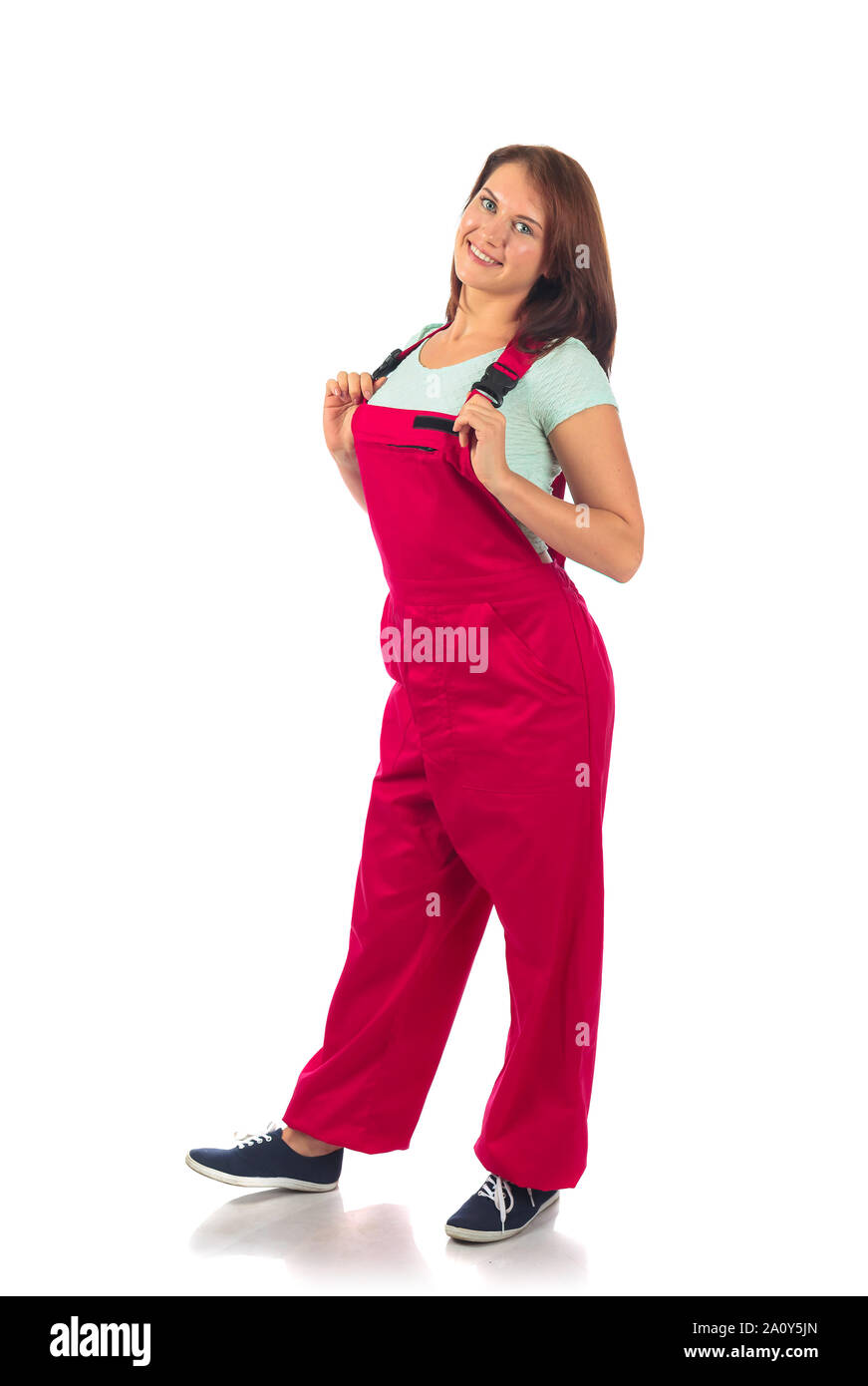 Attractive woman in red overalls, isolated on a white background Stock ...