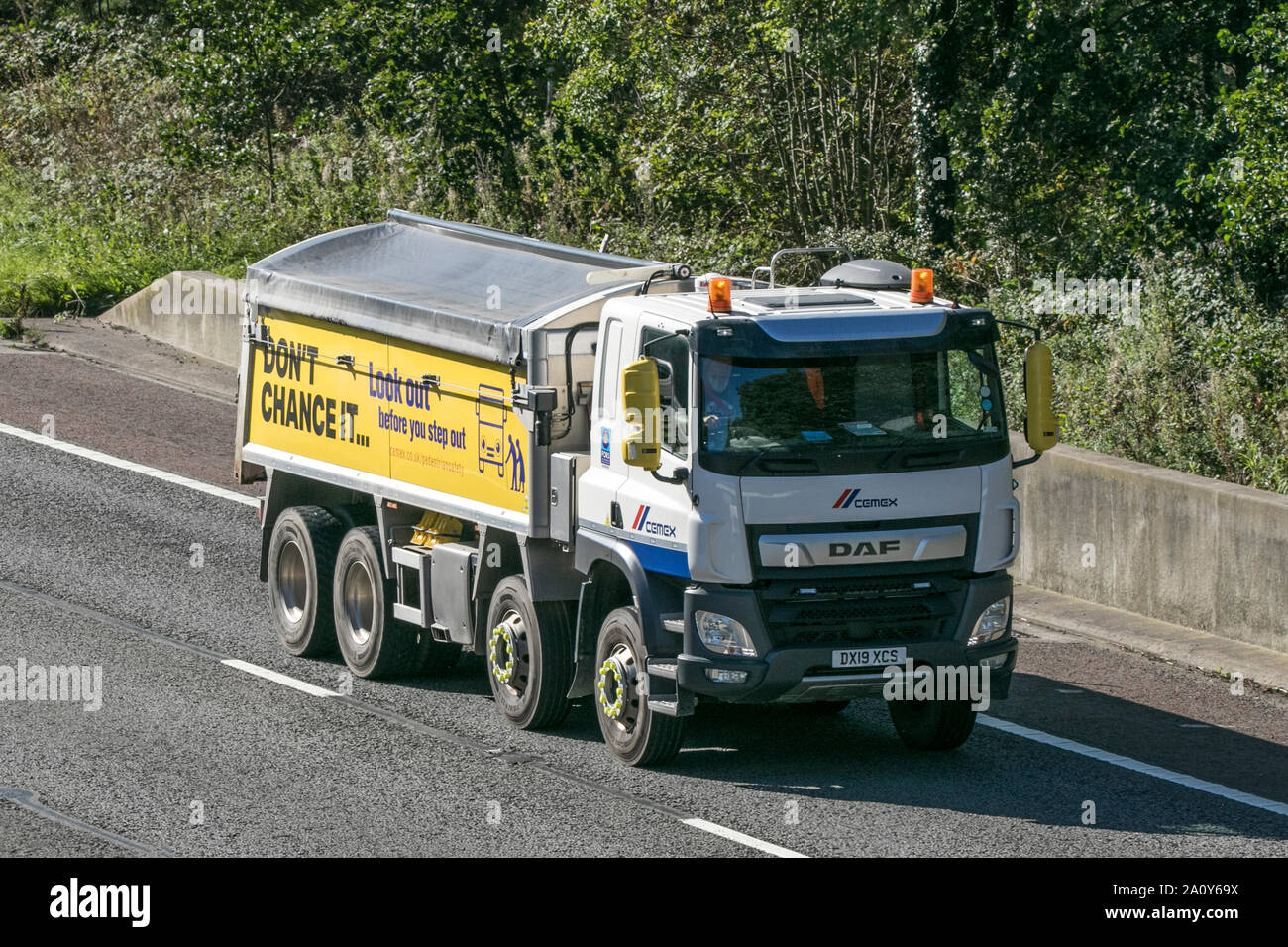 A DAF Cemex aggregate freight truck travelling northbound on the M6 ...