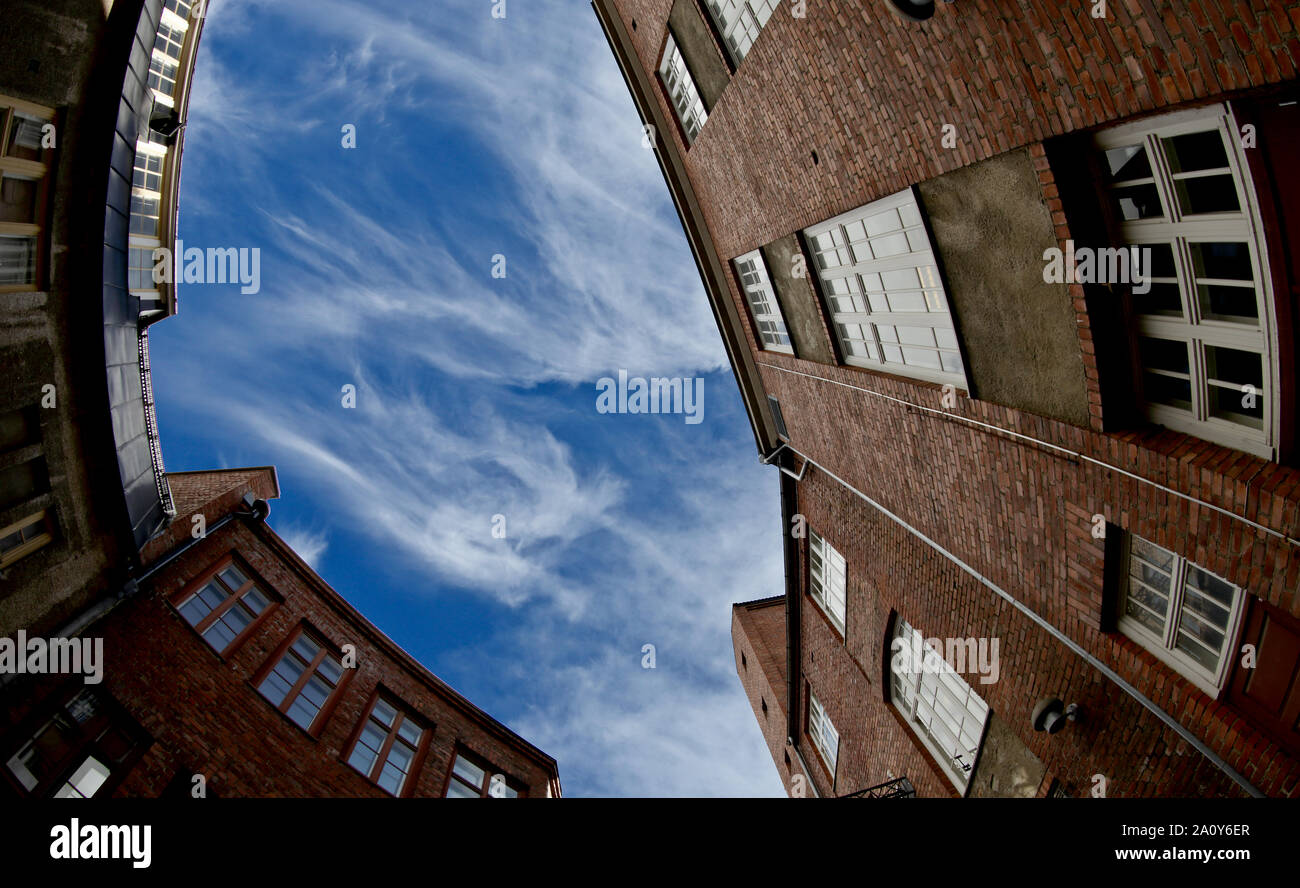 A fish eye image of an old factory building with blue sky above Stock ...