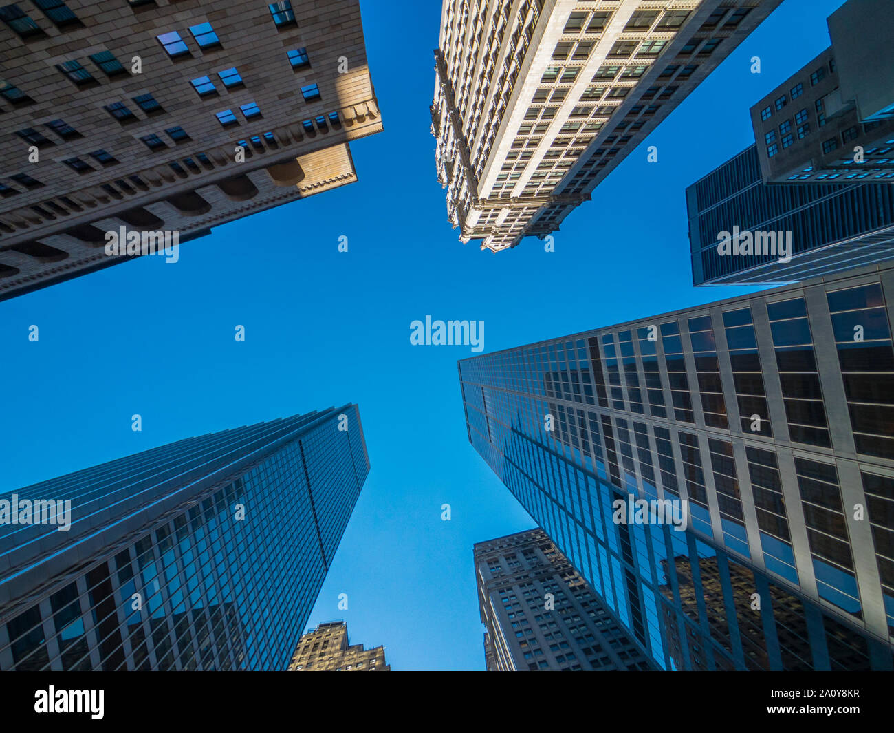 New York skyscrapers bottom view blue sky Stock Photo - Alamy