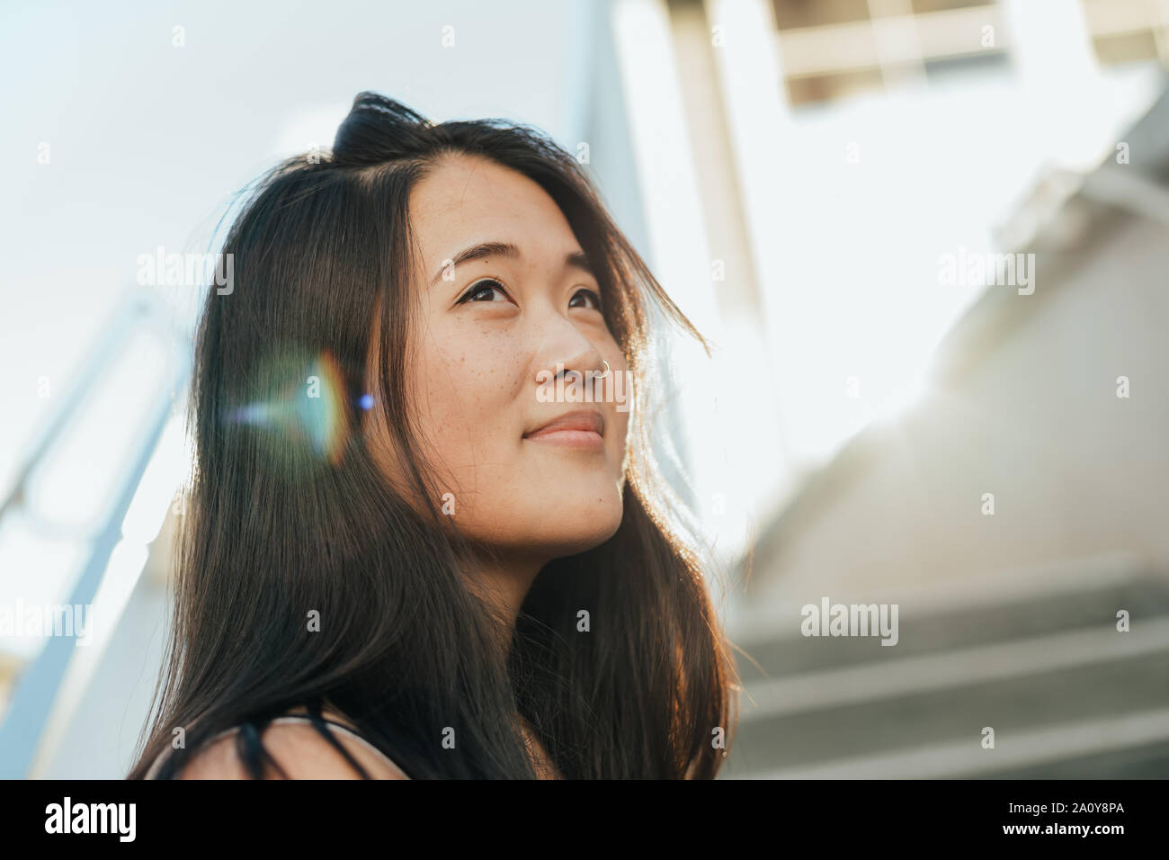 Young woman looking towards the sky hi-res stock photography and images ...