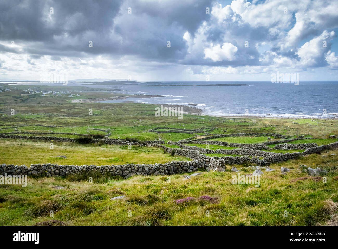Old stone walls and the Atlantic Ocean in Doenegal Ireland Stock Photo ...