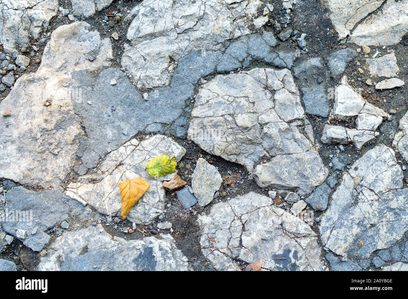 A wall of rough stones of irregular shape as a natural background for ...