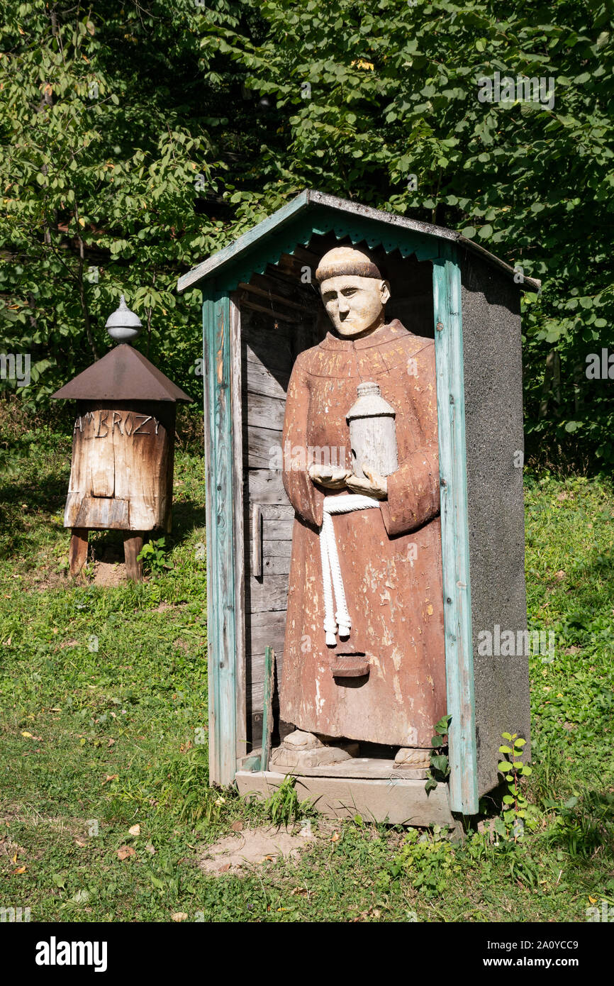 Sculpture of a monk - wooden art beehive in open air museum in Sanok ...