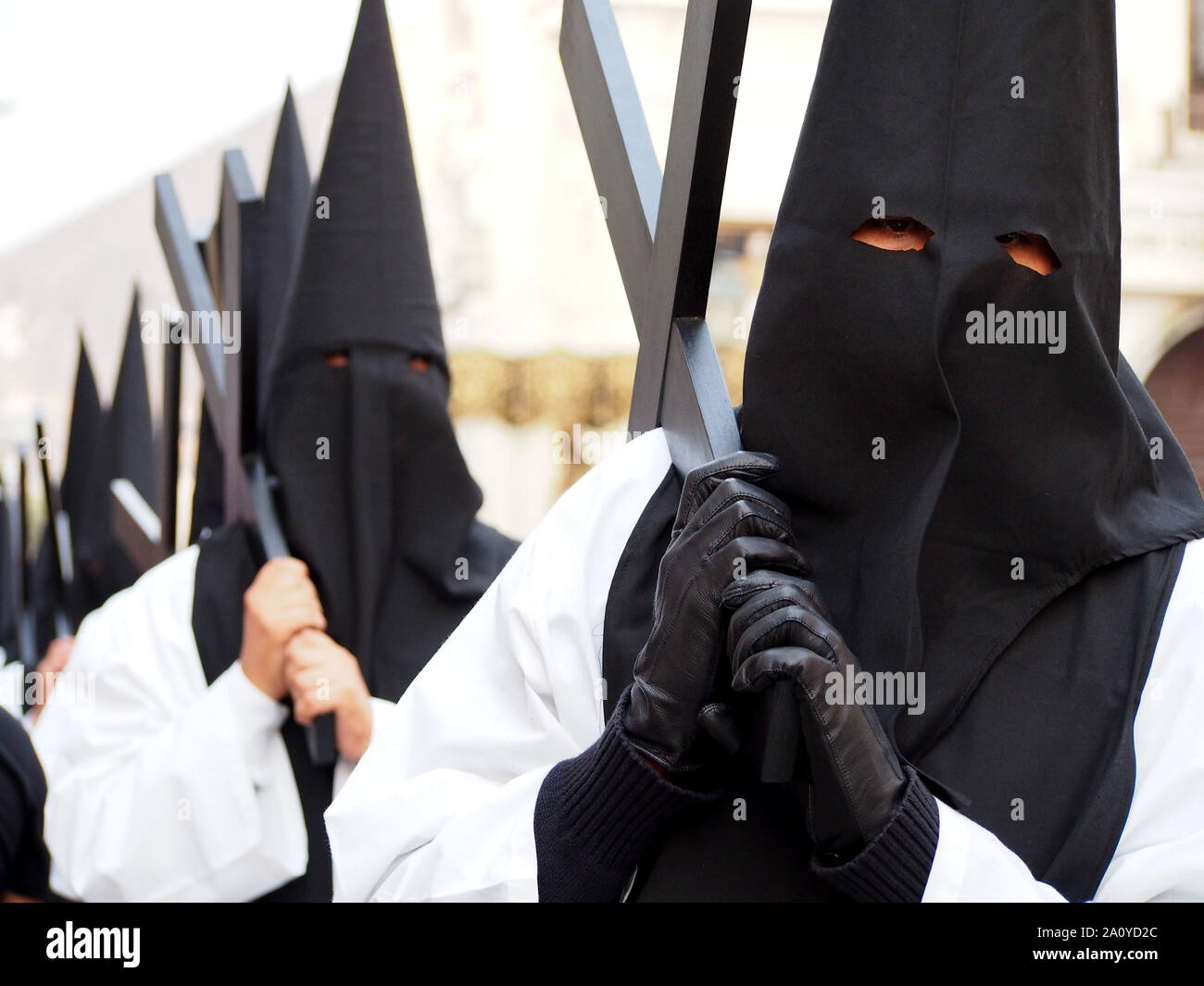 Hooded devotee, from Our Lady of Loneliness brotherhood, in a religious ...