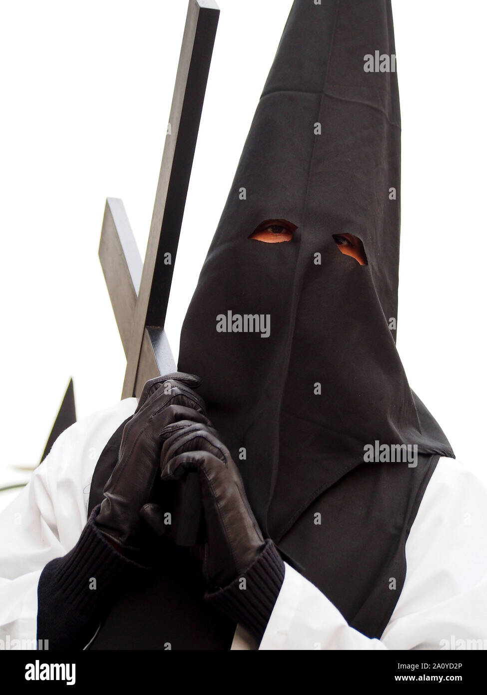 Hooded devotee, from Our Lady of Loneliness brotherhood, in a religious ...