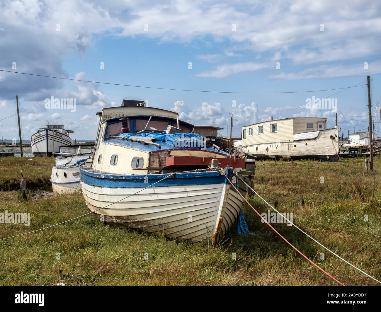 WEST MERSEA, ESSEX, UK - AUGUST 31, 2018: Boats and houseboats on the ...