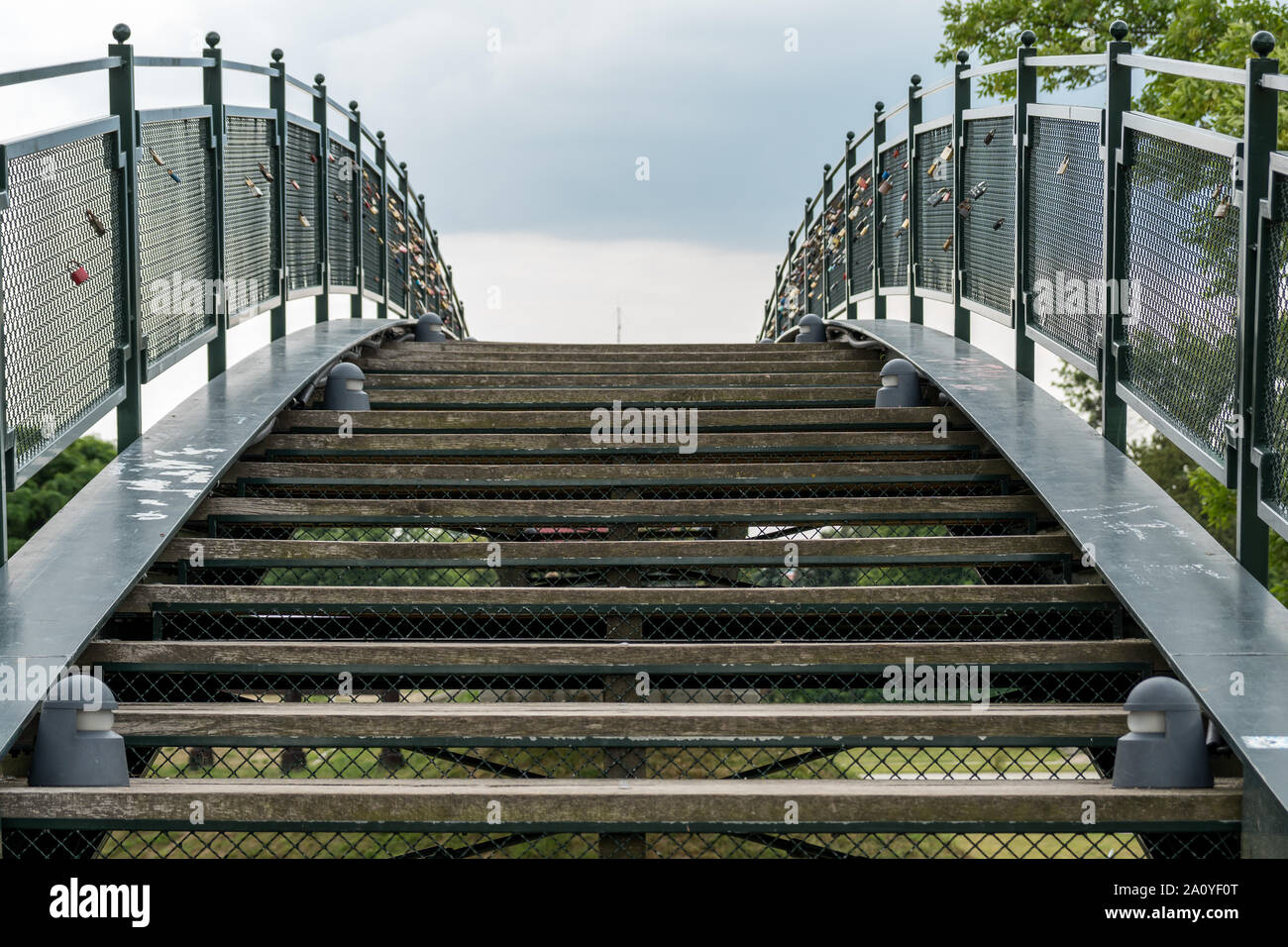 a small bridge with wooden stairs and metal balustrade Stock Photo - Alamy
