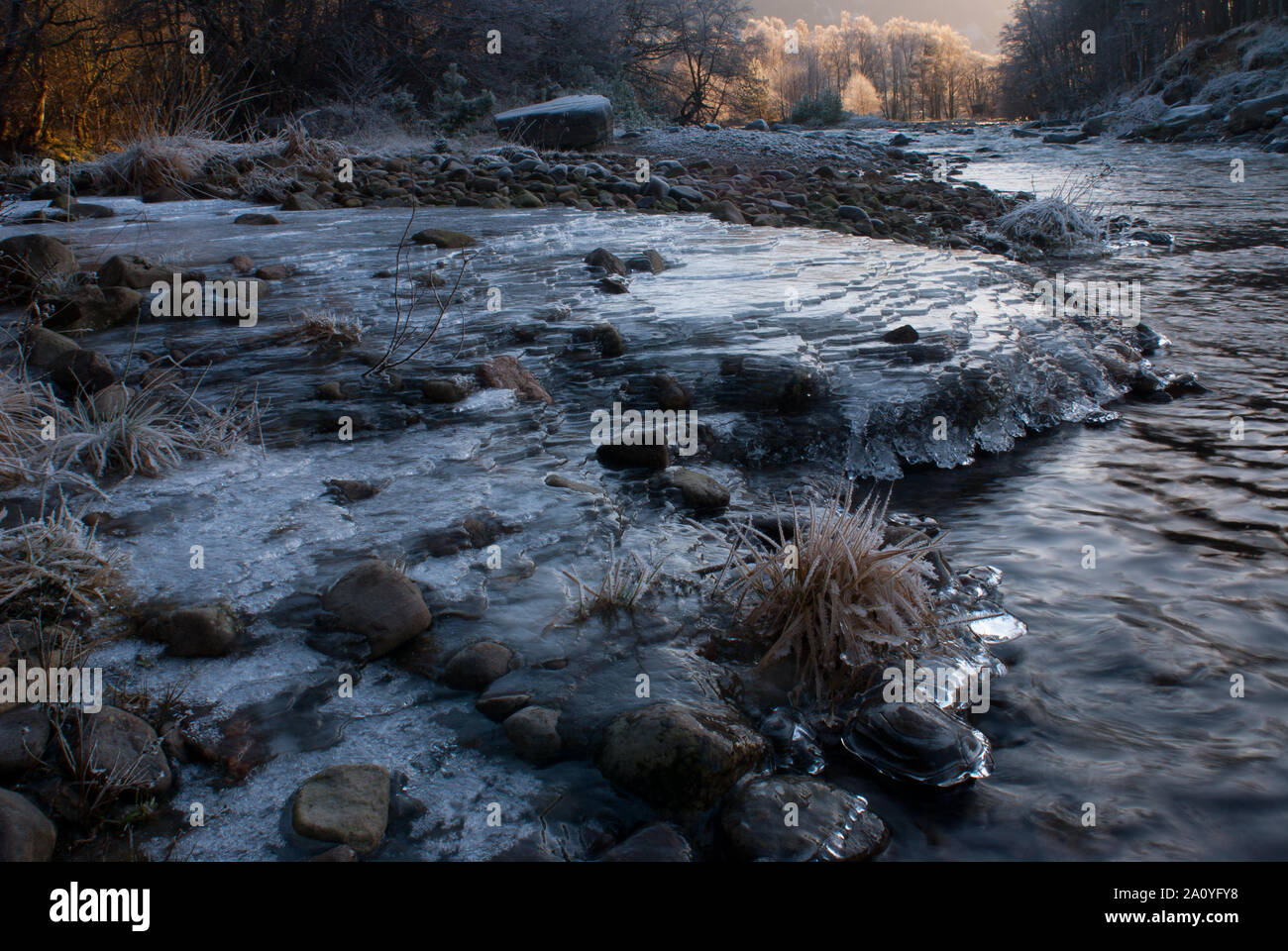 Stream frozen into a cascading ice fall, River Feshie, Cairngorm ...