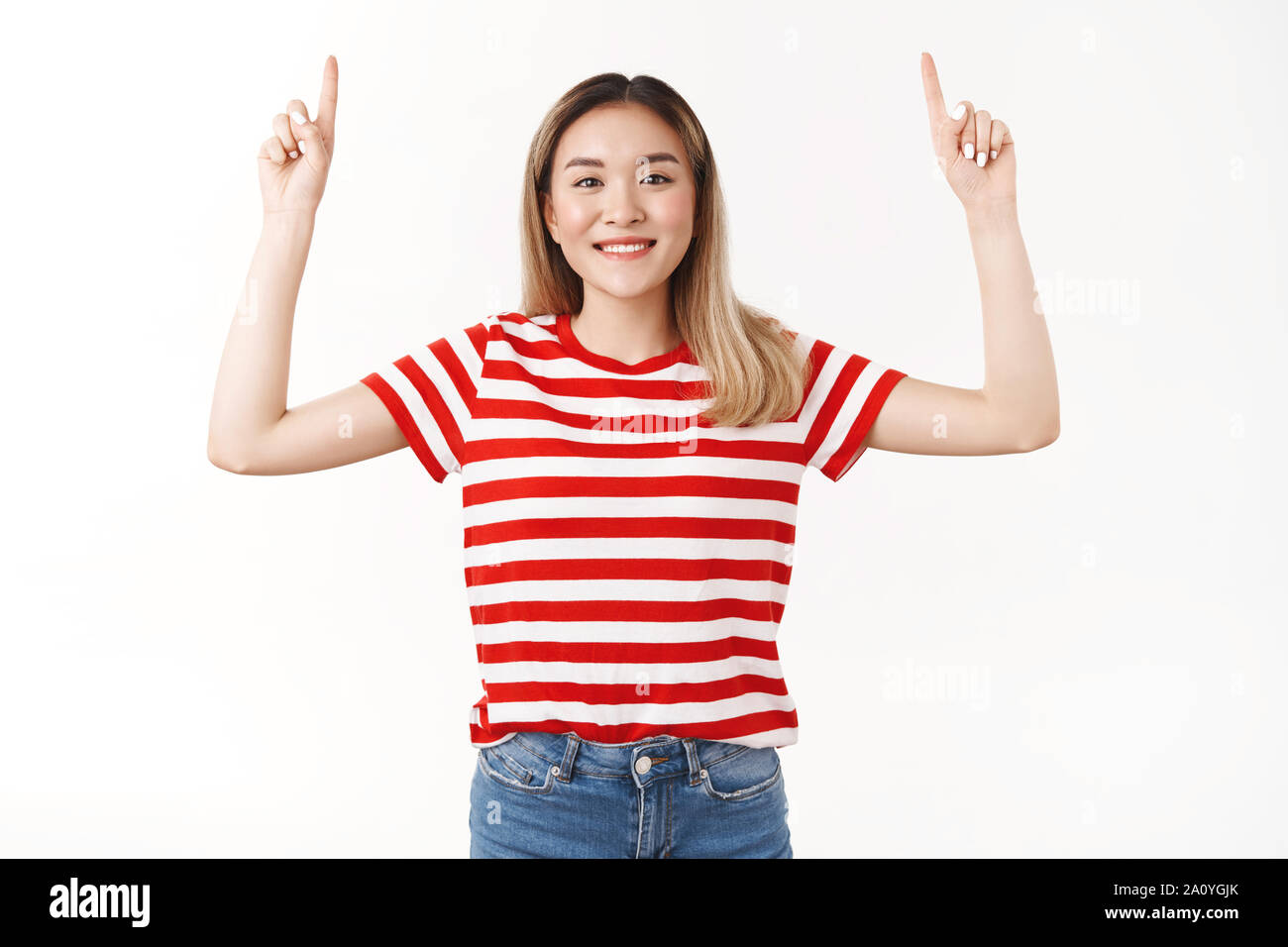 Cheerful upbeat positive asian teenage girl raise hands up proudly ...