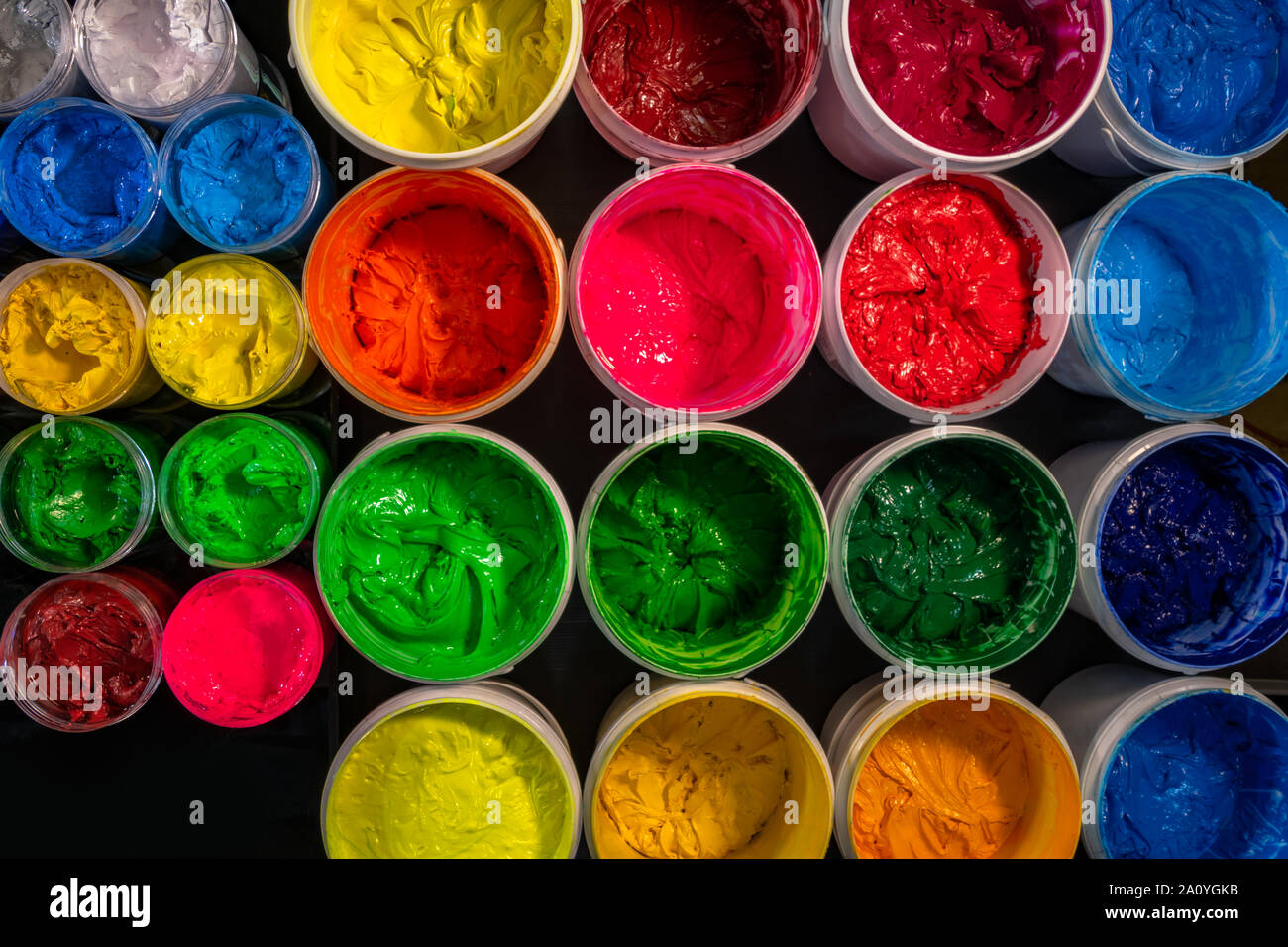 several color plastisol ink cans in factory who use plastisol ink to ...