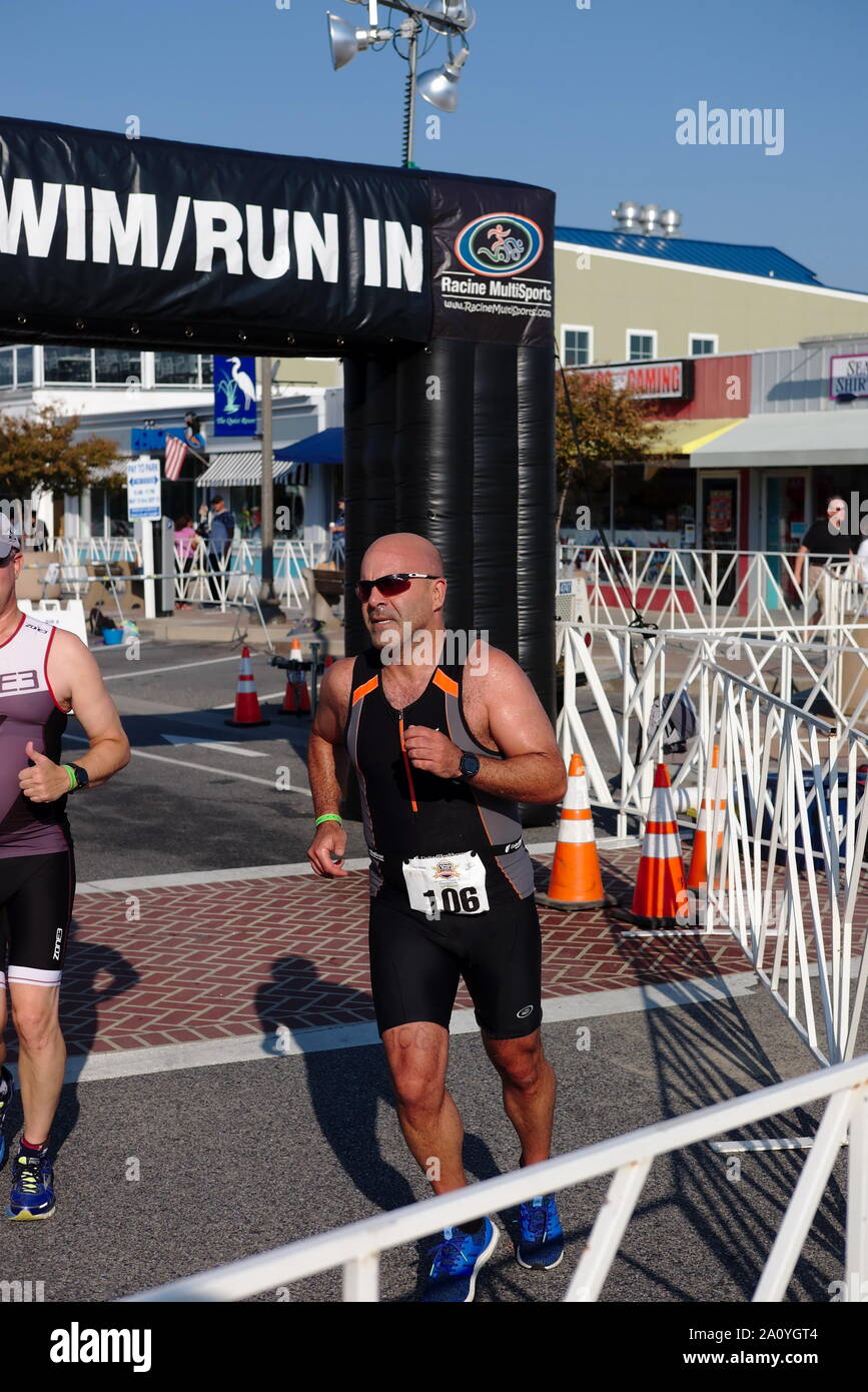 Male runner exits the transition zone of the Bethany Beach First ...