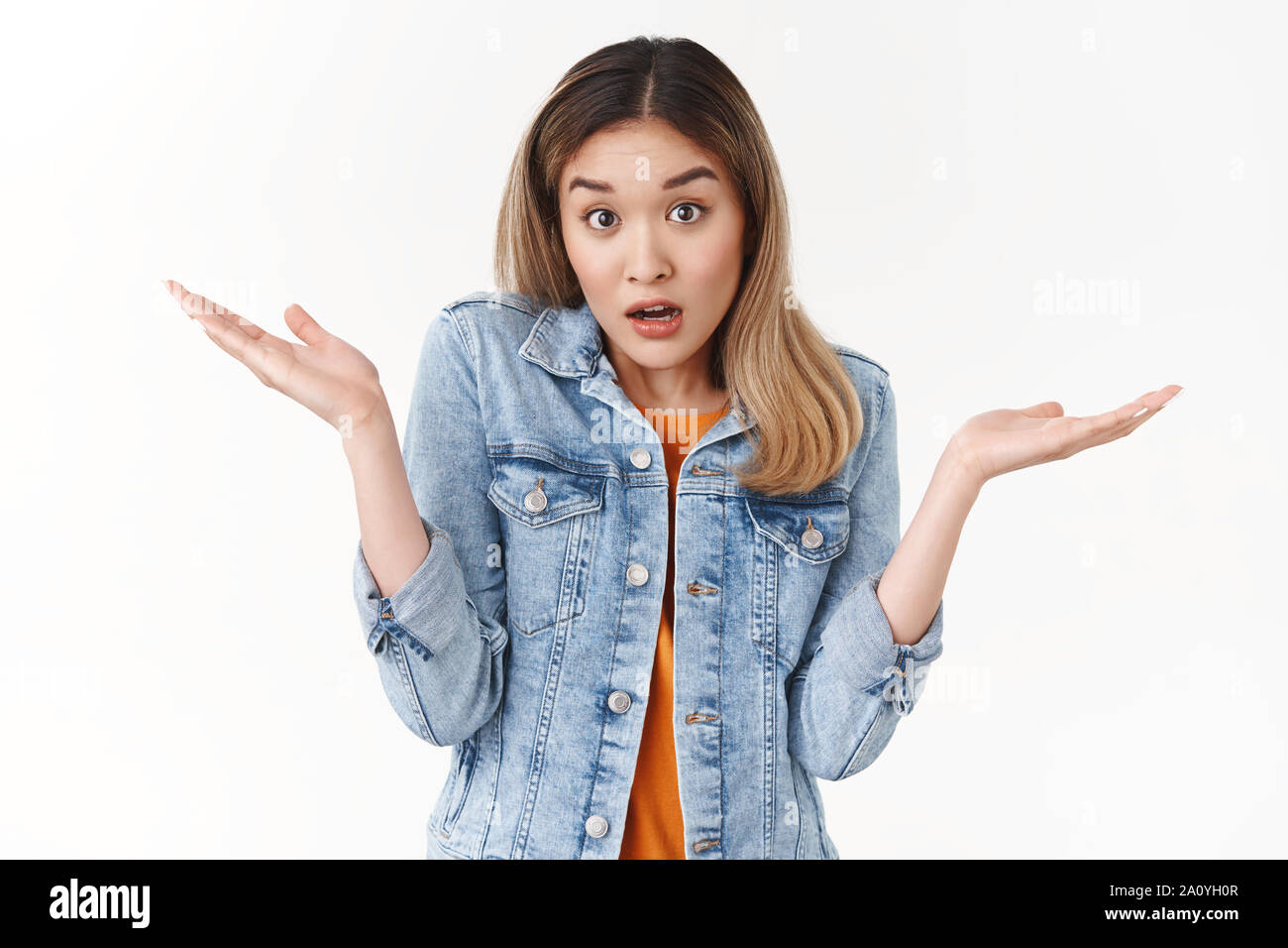I not know. Unaware clueless silly blond asian girl shrugging hands ...