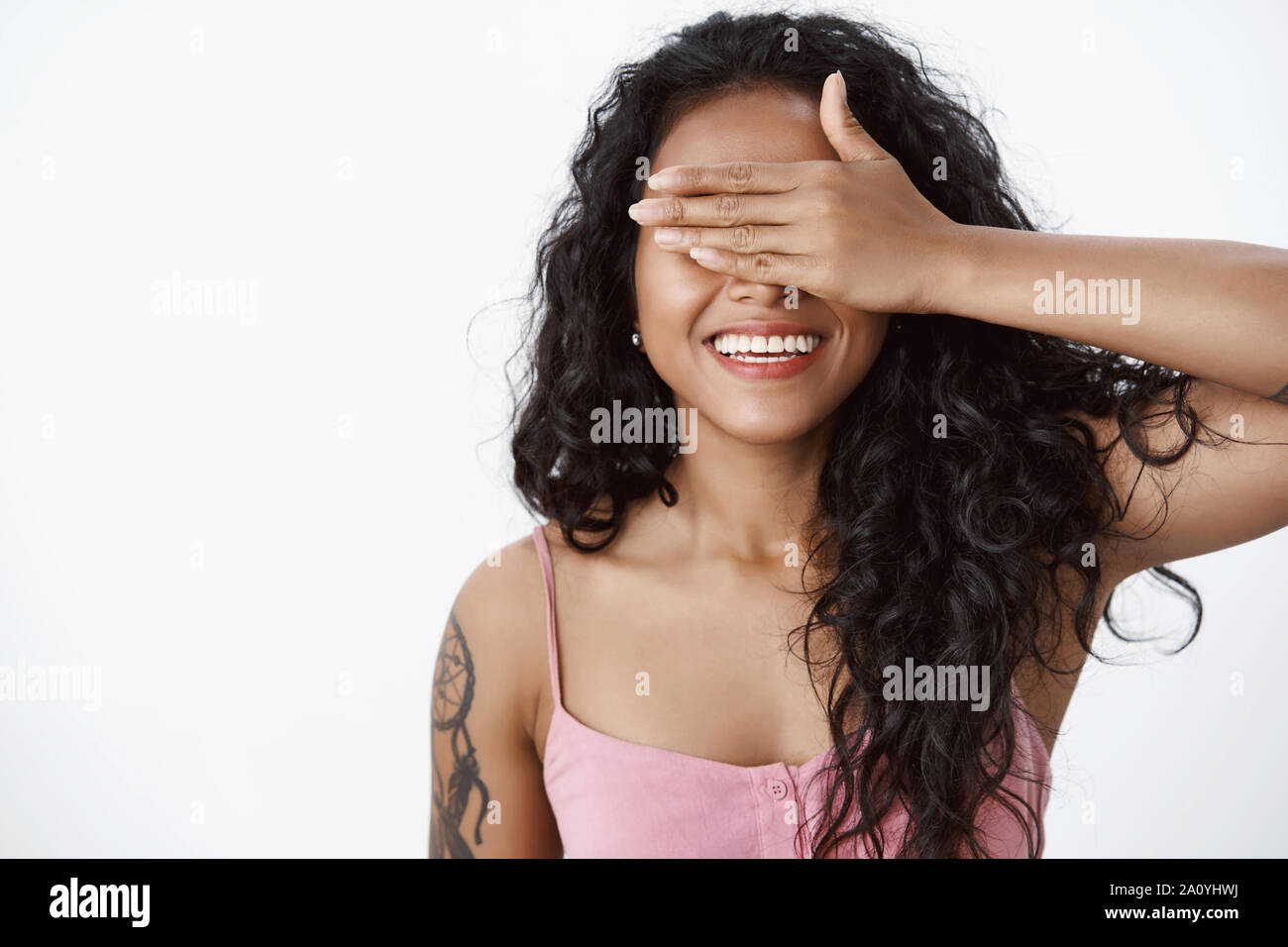 Happy Enthusiastic African American Curly Haired Girl With Tattoos And