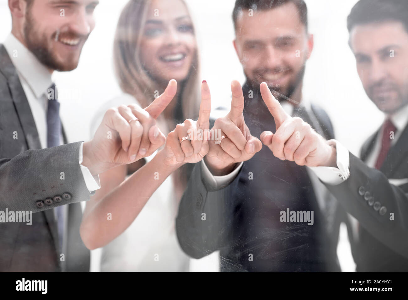 business team pointing to a virtual point .the concept of purpose Stock ...