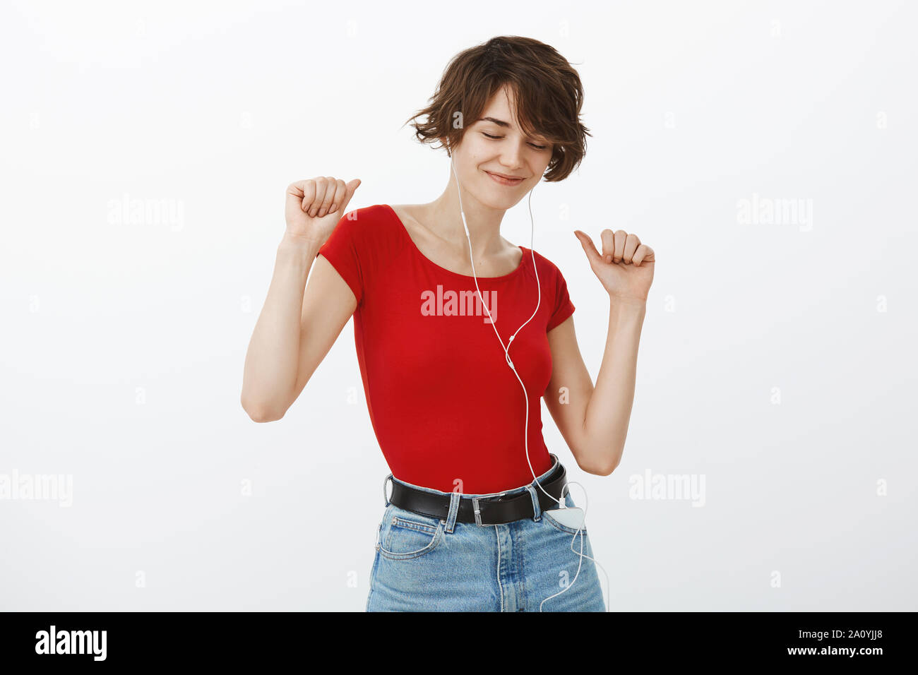 Cheerful carefree modern hipster girl pixie haircut close eyes smiling ...