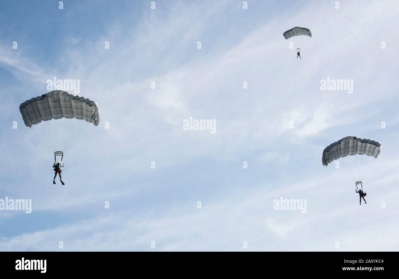 U.S. Air Force Special Tactics operators jump into the sound from an MC ...