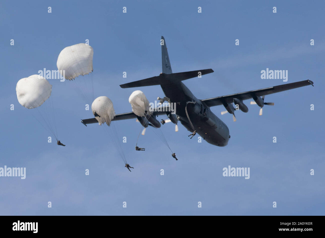 A group of U.S. Army and International Paratroopers parachute out of C ...