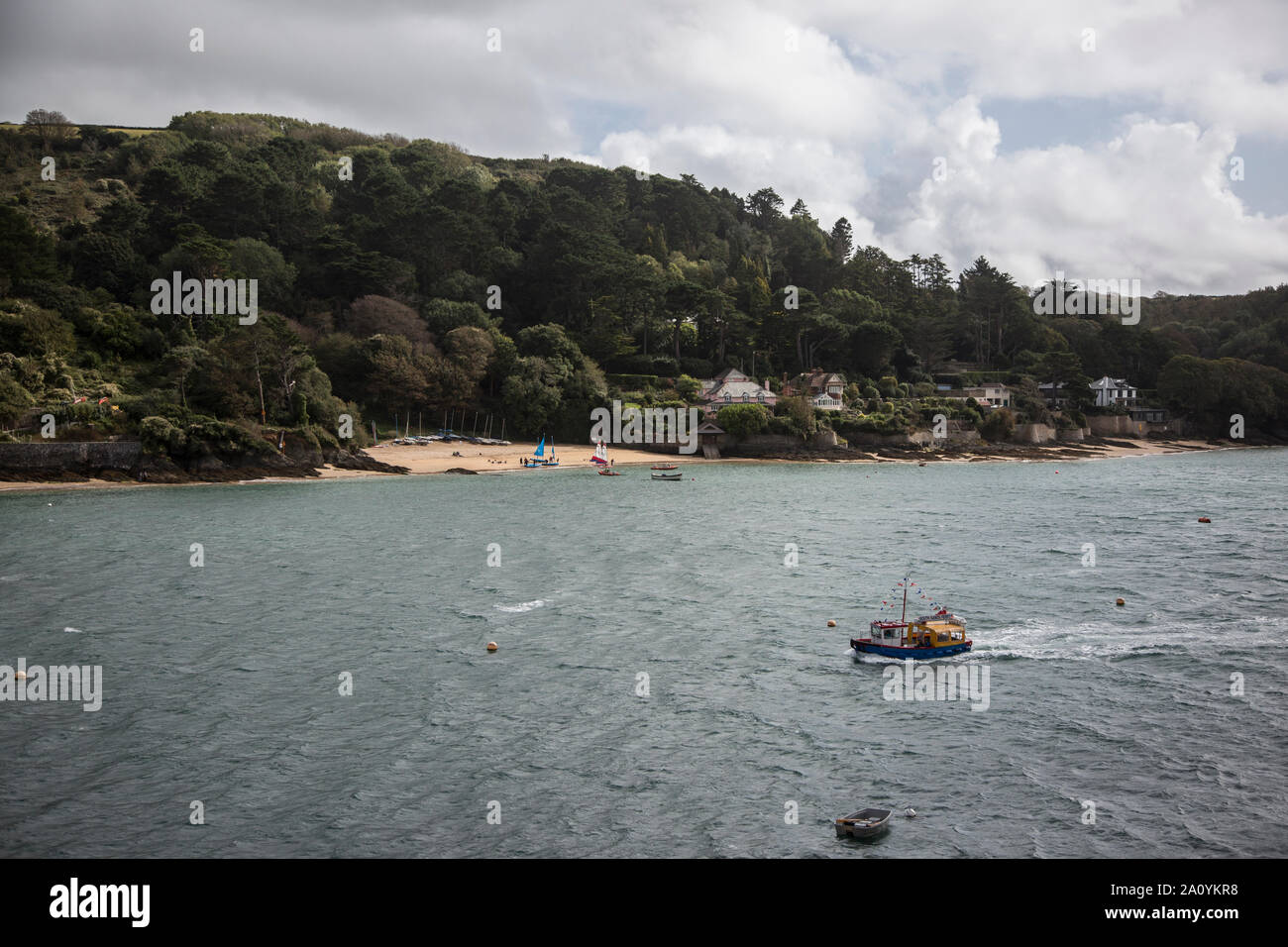 South Sands ferry sailing down the estuary to Salcombe town on a calm ...