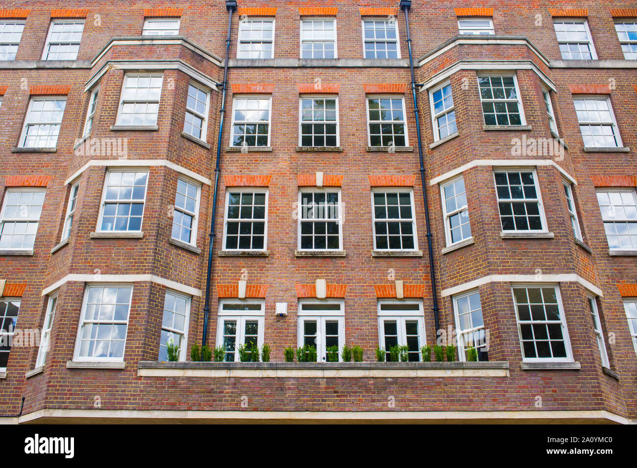 Facade of anonymous English British apartments residential building in ...