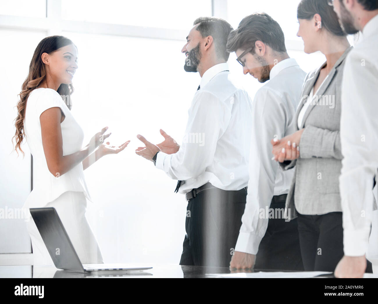 business team looks out the office window Stock Photo - Alamy