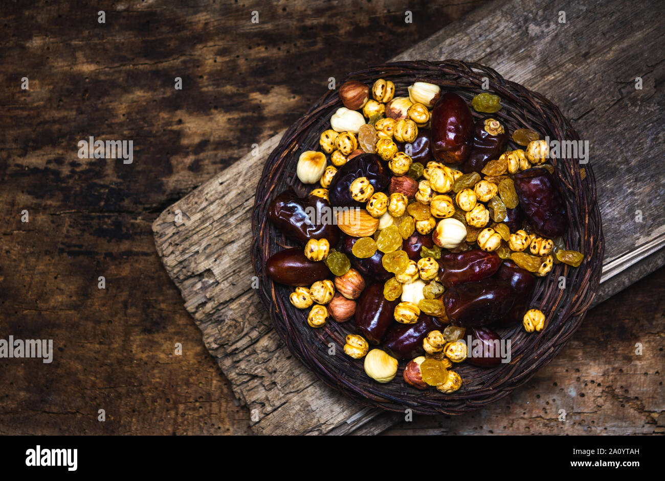 Mixed nuts with dates and raisins for a healthy snack Stock Photo - Alamy