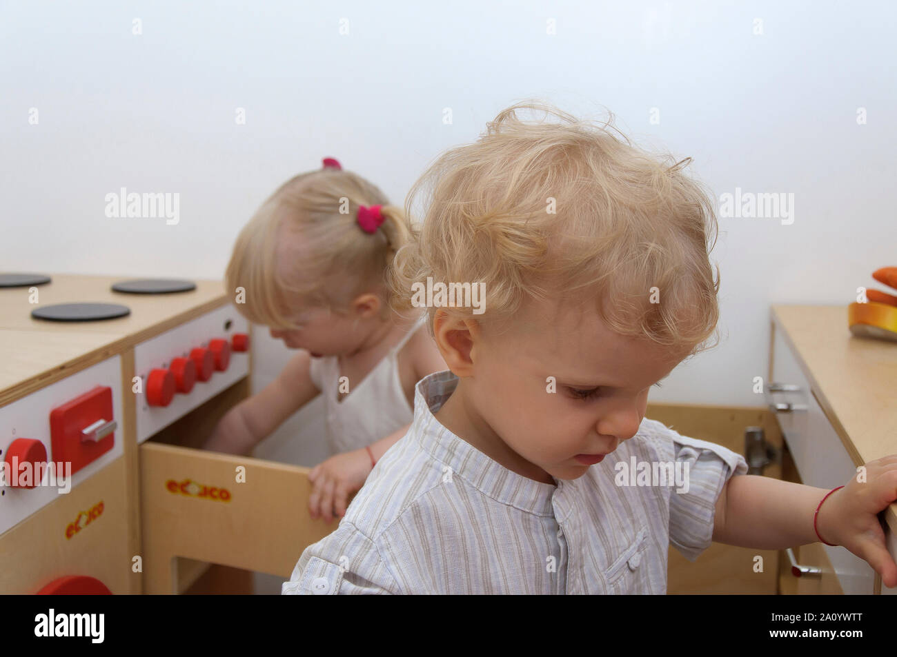 Adorable cute two years of age old blond hair little girl and boy twins ...