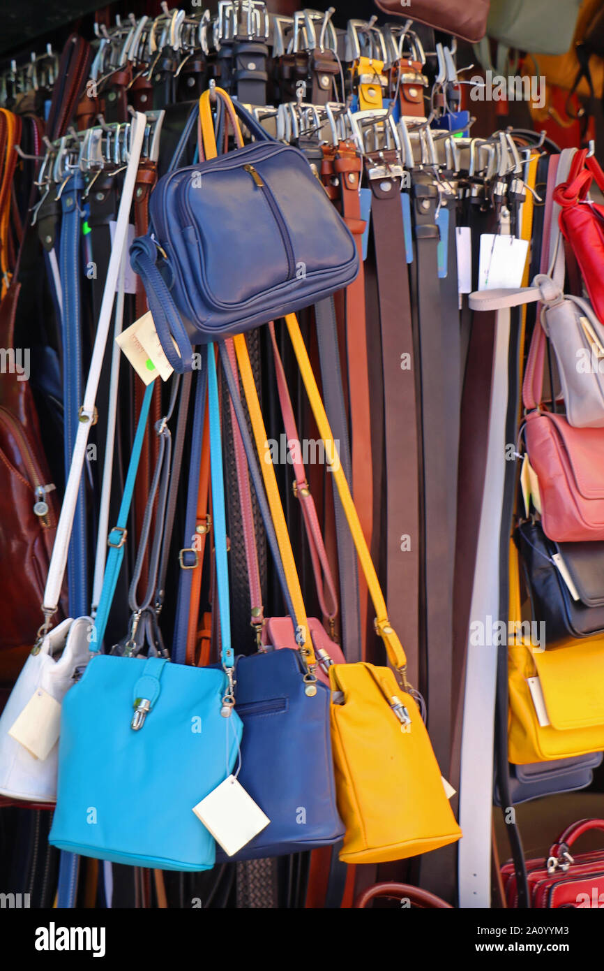 Leather colorful bags and belts sold on market Stock Photo - Alamy