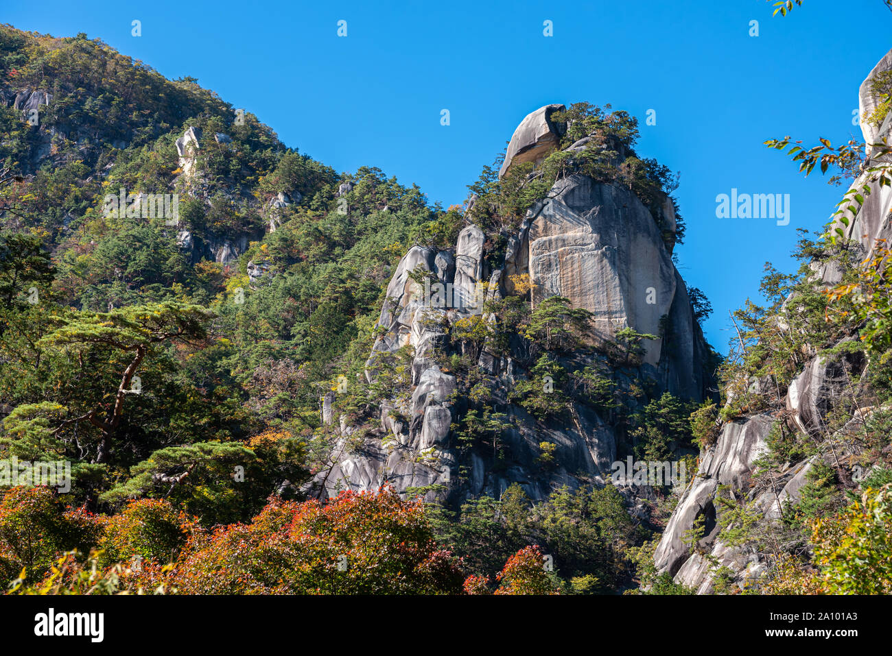 Rock Kakuenbou, a massive rocky mountain. Symbol of Mitake Shosenkyo ...