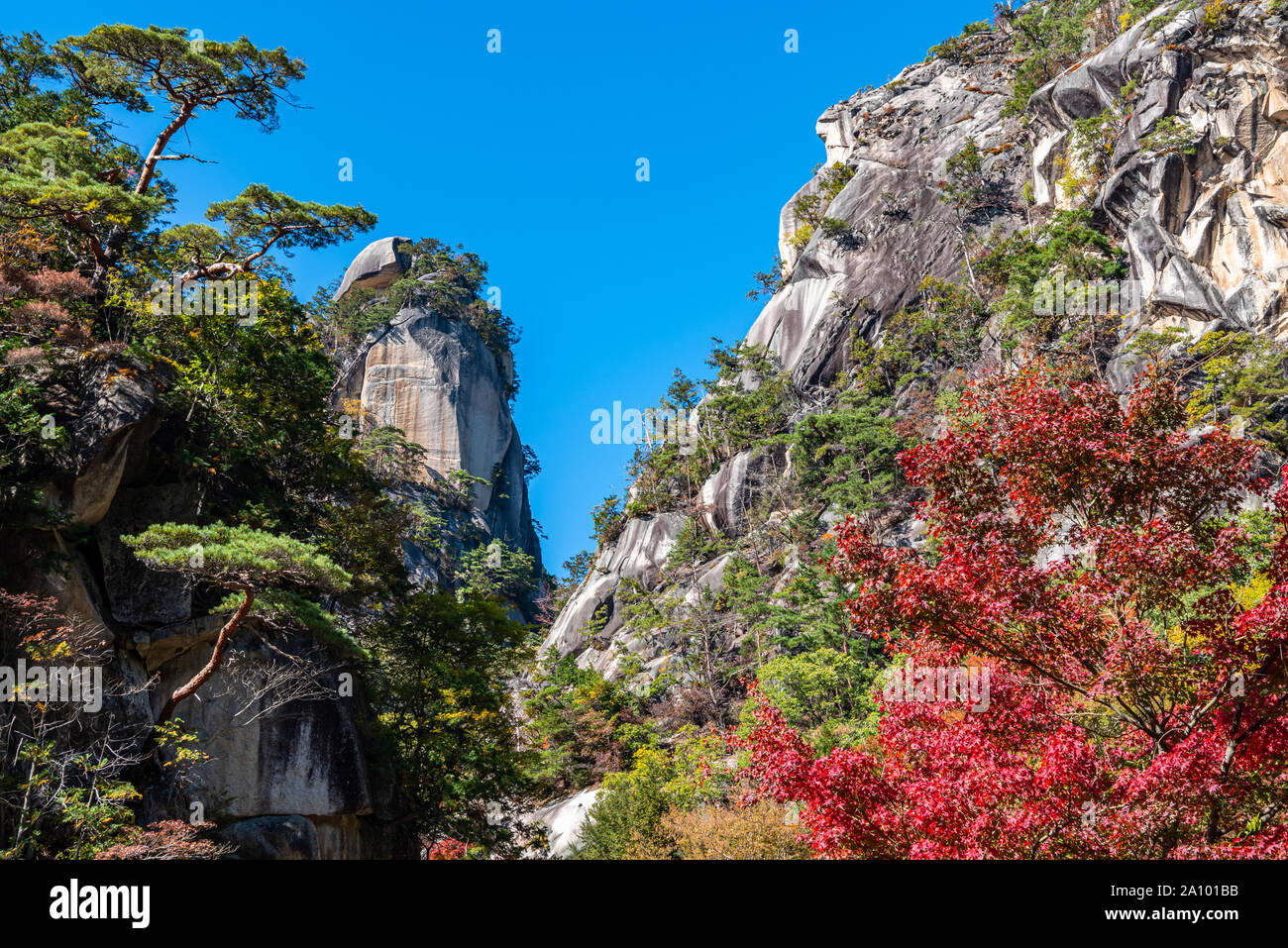 Rock Kakuenbou, a massive rocky mountain. Symbol of Mitake Shosenkyo ...