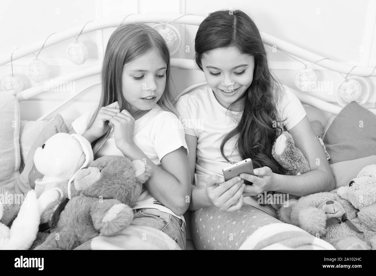 Children and mobile phone and video Black and White Stock Photos ...