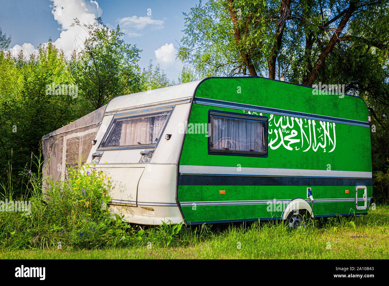 A car trailer, a motor home, painted in the national flag of Saudi ...