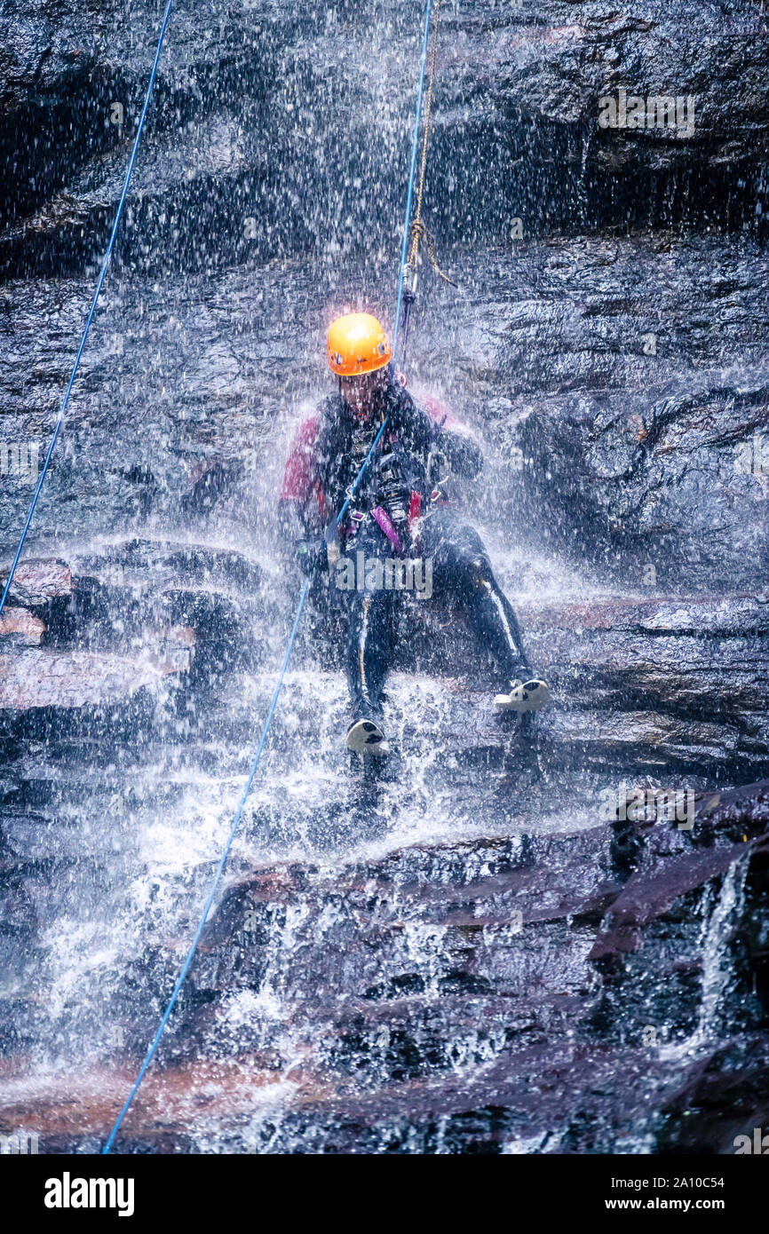 Blue Mountains, Australia - Sept 7 2019: Man sitting getting wet ...