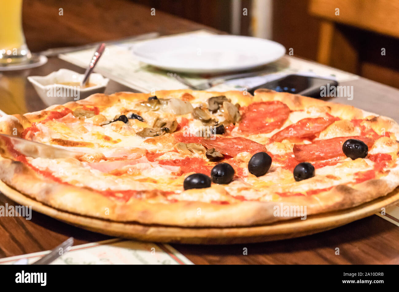 Pizza on a wood tray Stock Photo - Alamy