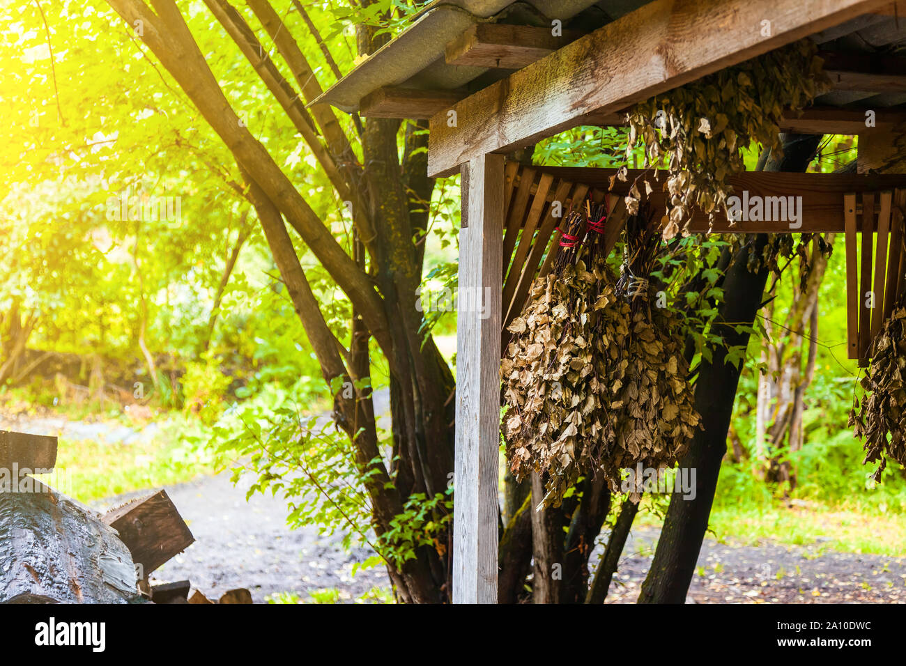 Brooms for a bath hang on the veranda near a country house in the ...