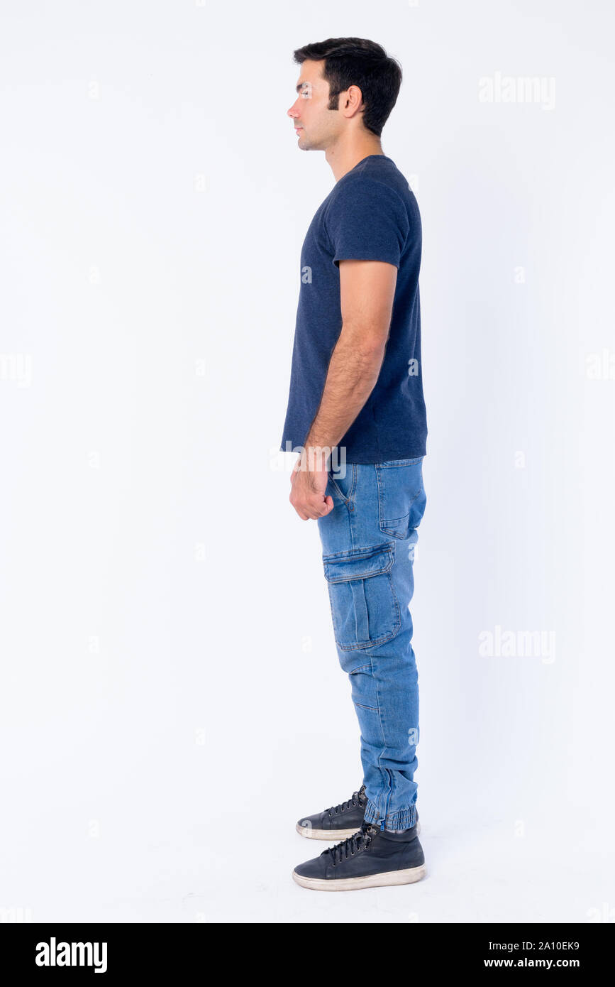 Full body shot profile view of young handsome Persian man Stock Photo ...
