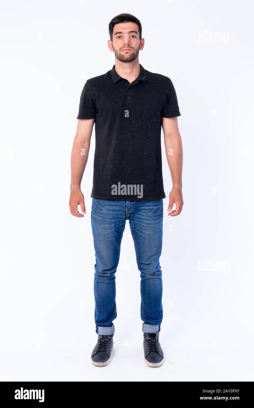 Full body shot of young bearded Persian man Stock Photo - Alamy