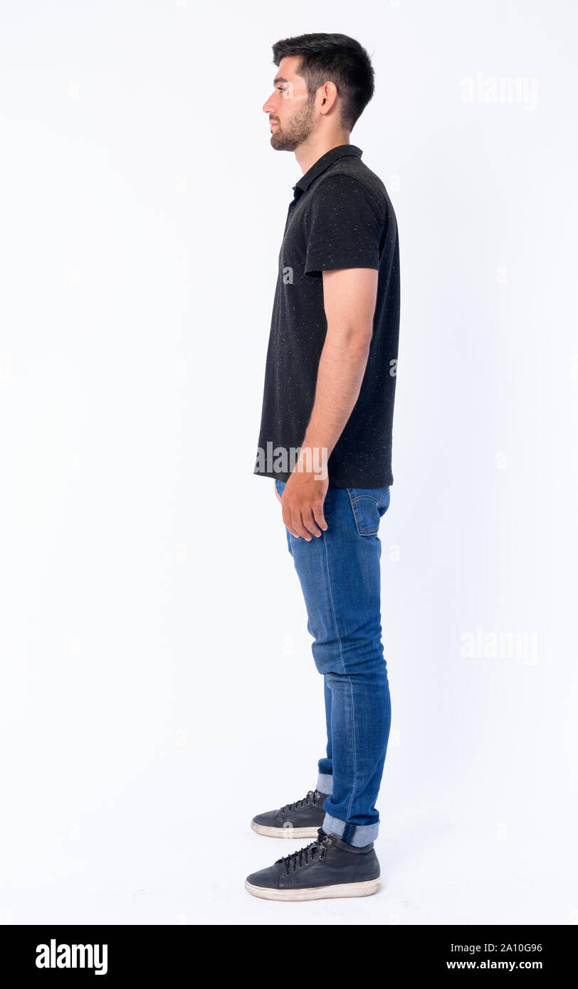 Full body shot profile view of young bearded Persian man Stock Photo ...