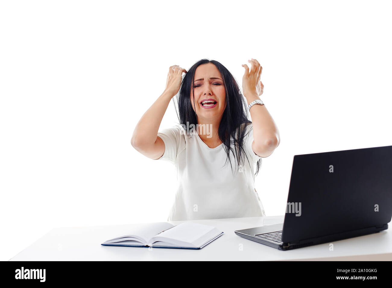 Angry businesswoman at the desk, isolated on white background Stock ...