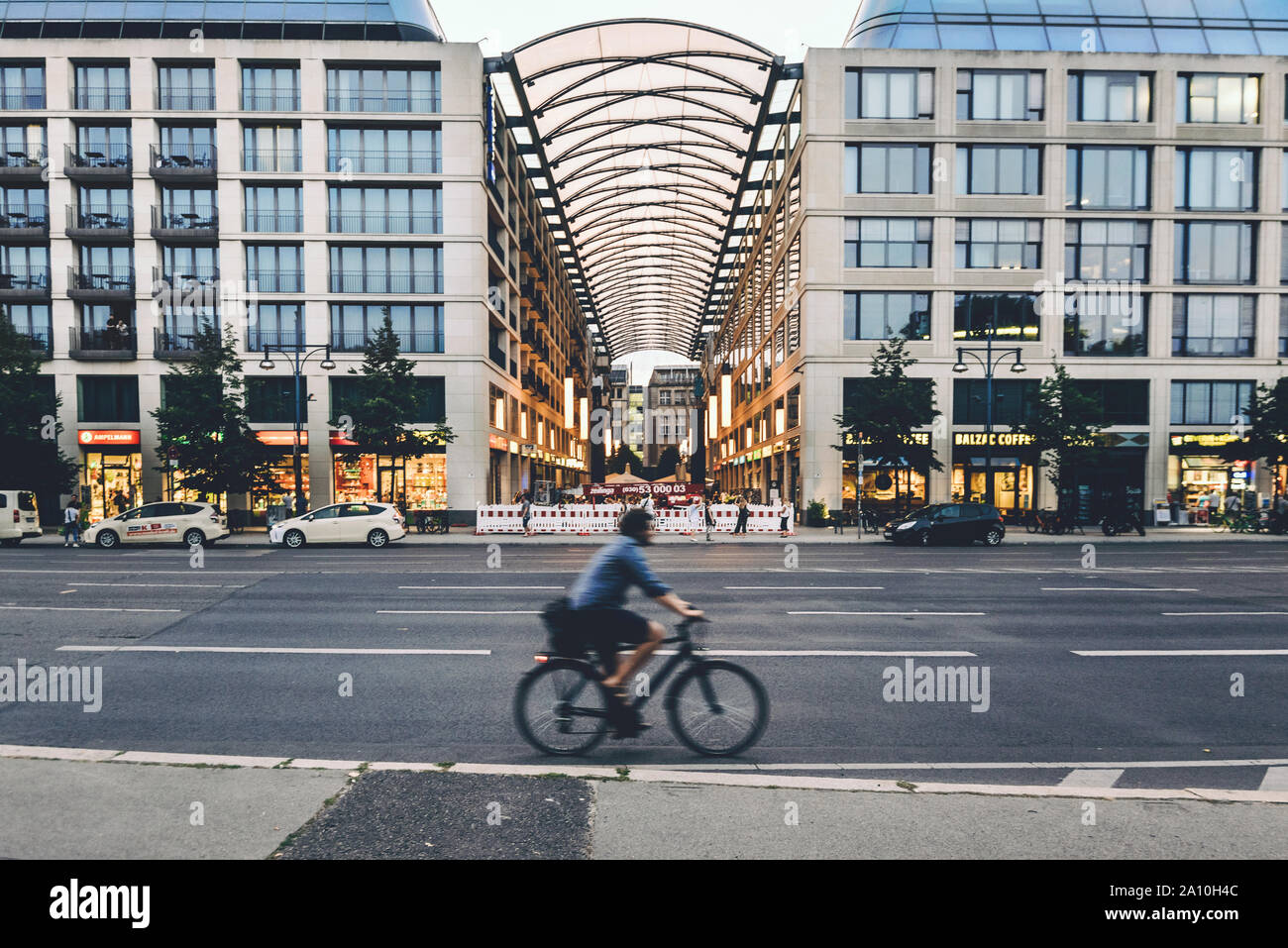 Man driving bicycle on street hi-res stock photography and images - Alamy