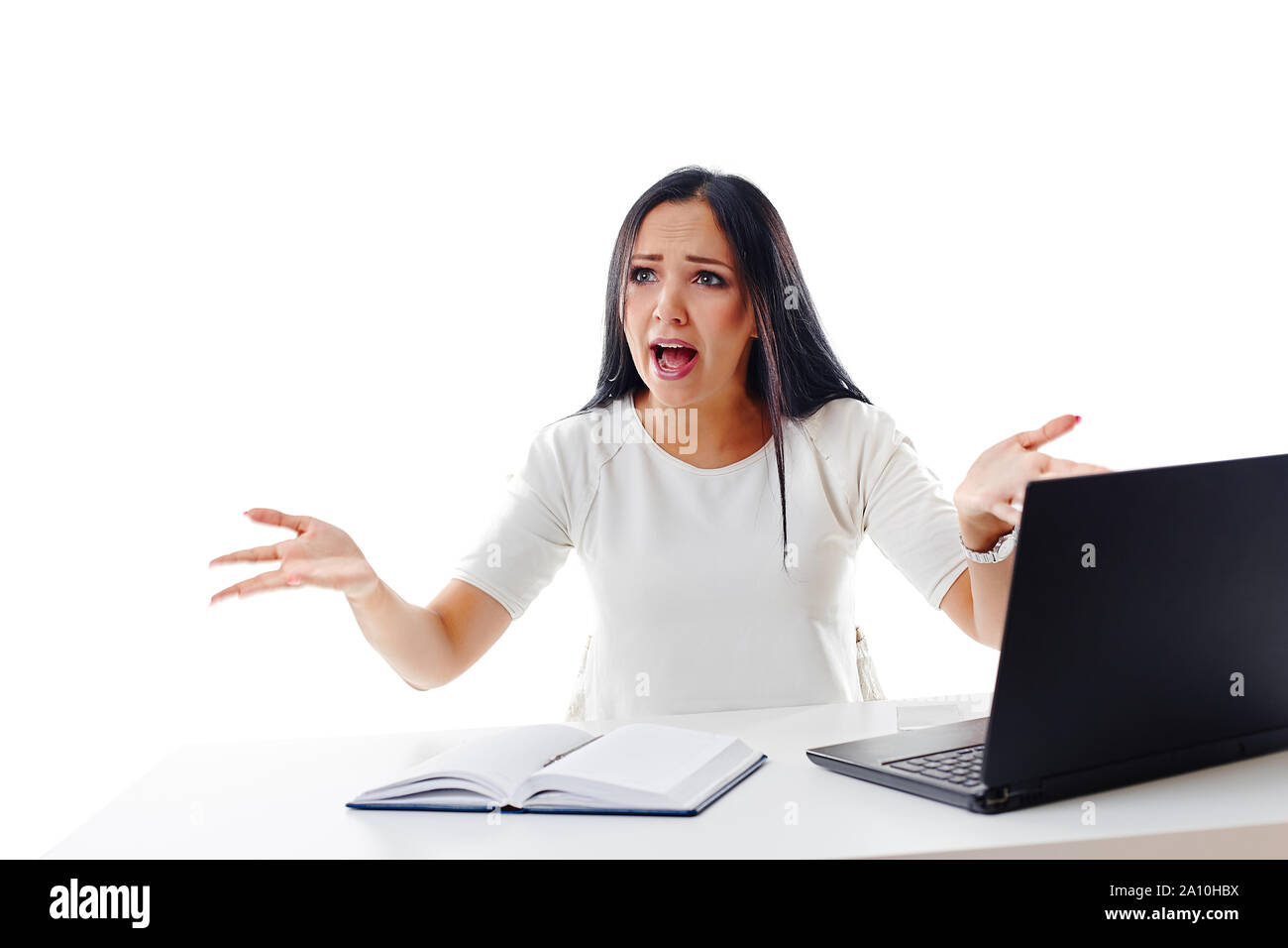 Angry businesswoman at the desk, isolated on white background Stock ...