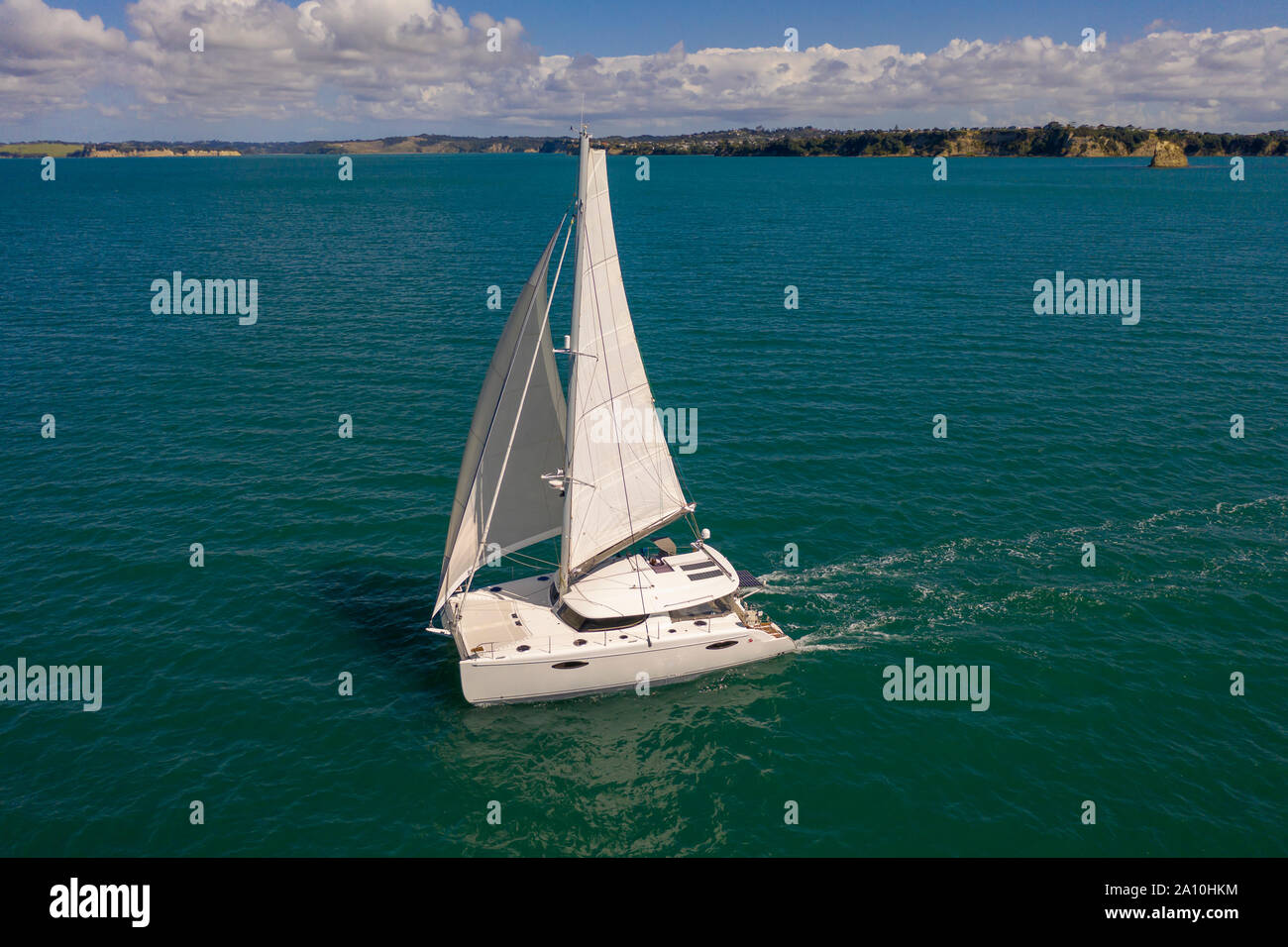 Cruising Catamaran sailing yacht under sail, shot from the air Stock ...