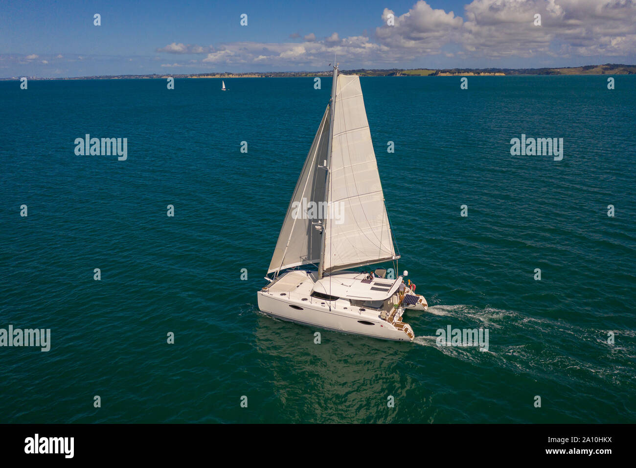 Cruising Catamaran sailing yacht under sail, shot from the air Stock ...
