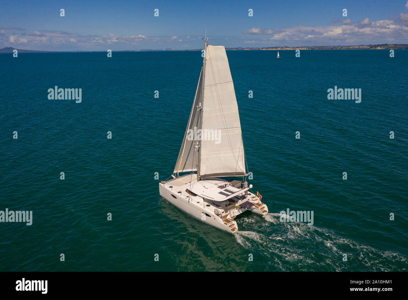 Cruising Catamaran sailing yacht under sail, shot from the air Stock ...