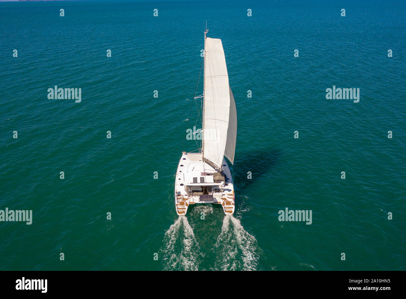 Cruising Catamaran sailing yacht under sail, shot from the air Stock ...
