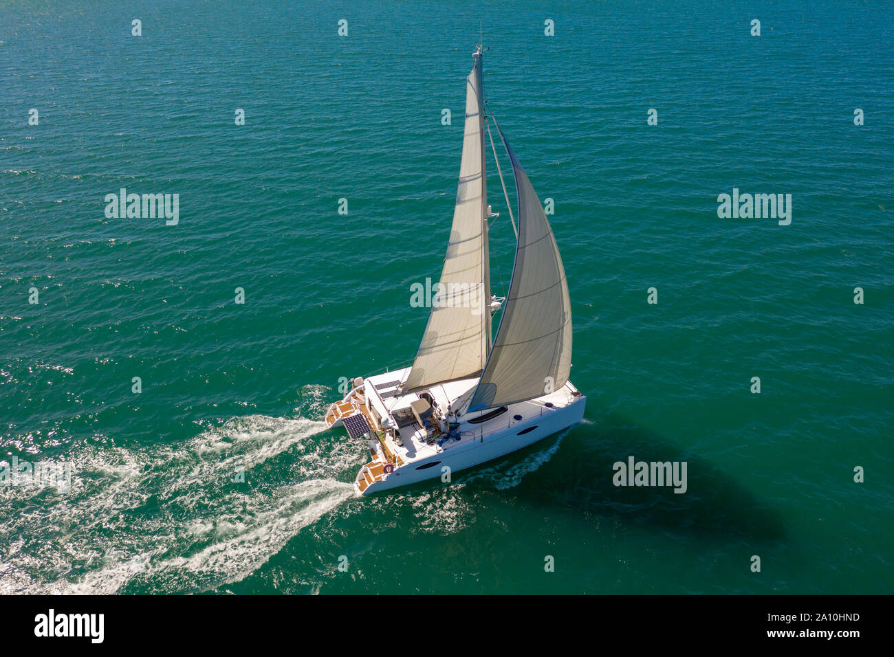 Cruising Catamaran sailing yacht under sail, shot from the air Stock ...