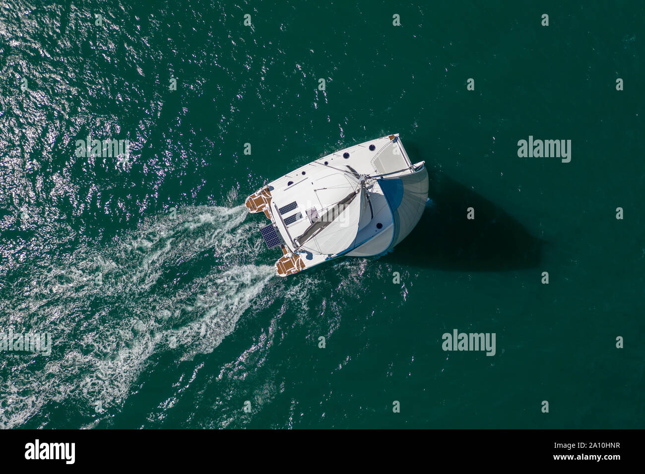 Cruising Catamaran sailing yacht under sail, shot from the air Stock ...
