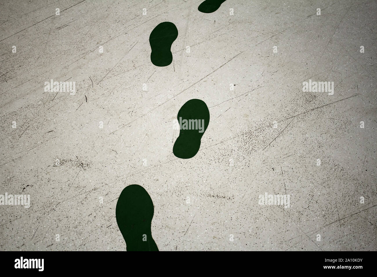 Footprints painted on wall, symbol and texture Stock Photo - Alamy