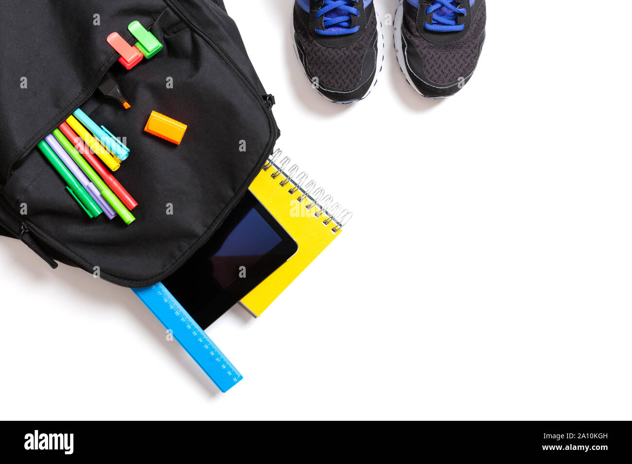 Back to school concept. Backpack with school supplies, tablet and sport ...
