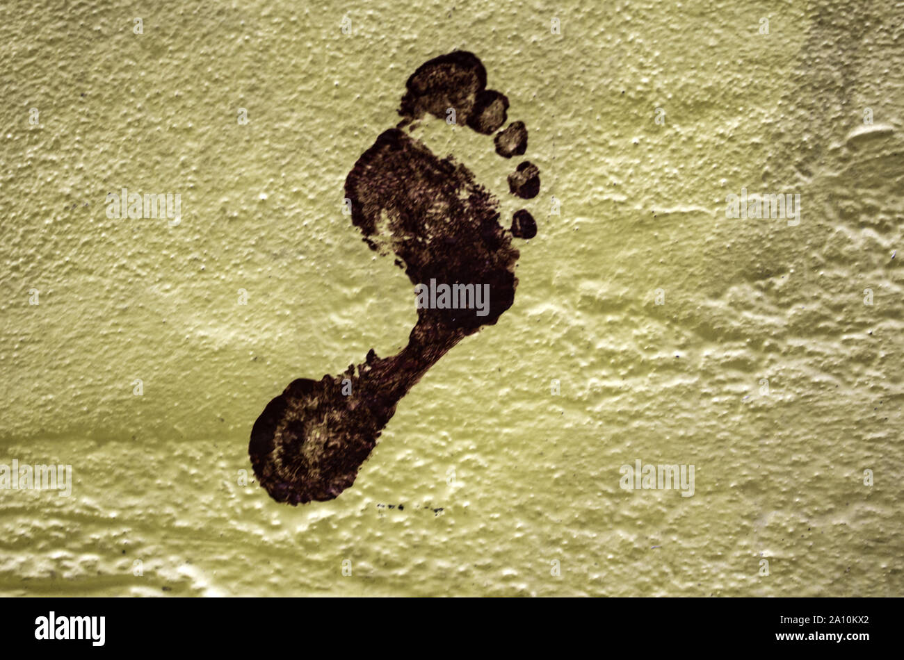 Footprints painted on wall, symbol and texture Stock Photo - Alamy